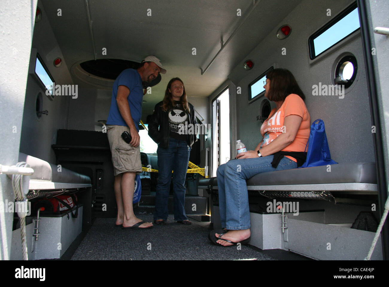 Aug 28, 2010 - Dana Point, California, U.S. - A family sits inside a ...
