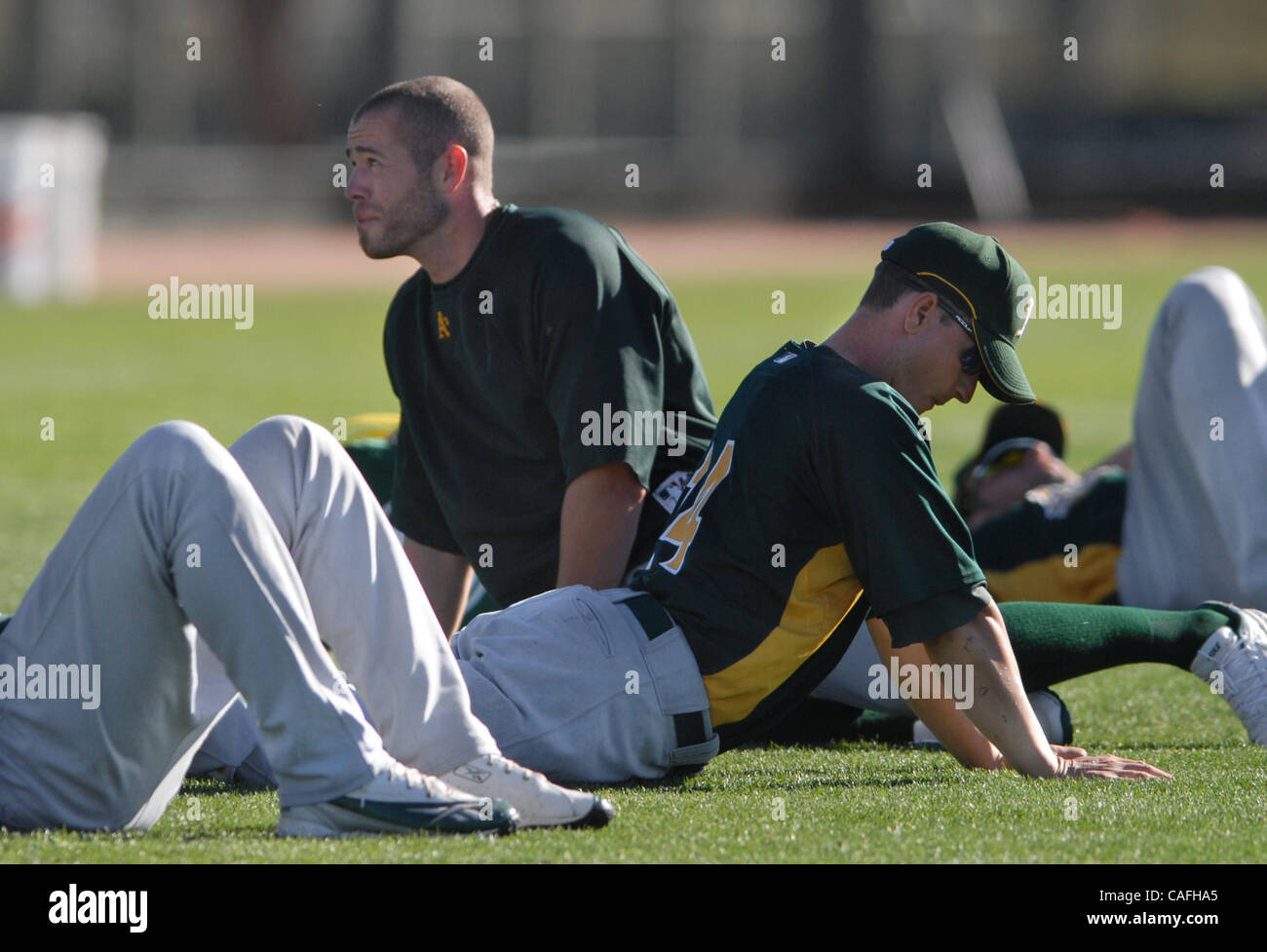 Oakland Athletics shortstop Mark Ellis, right, does an Upward Facing ...