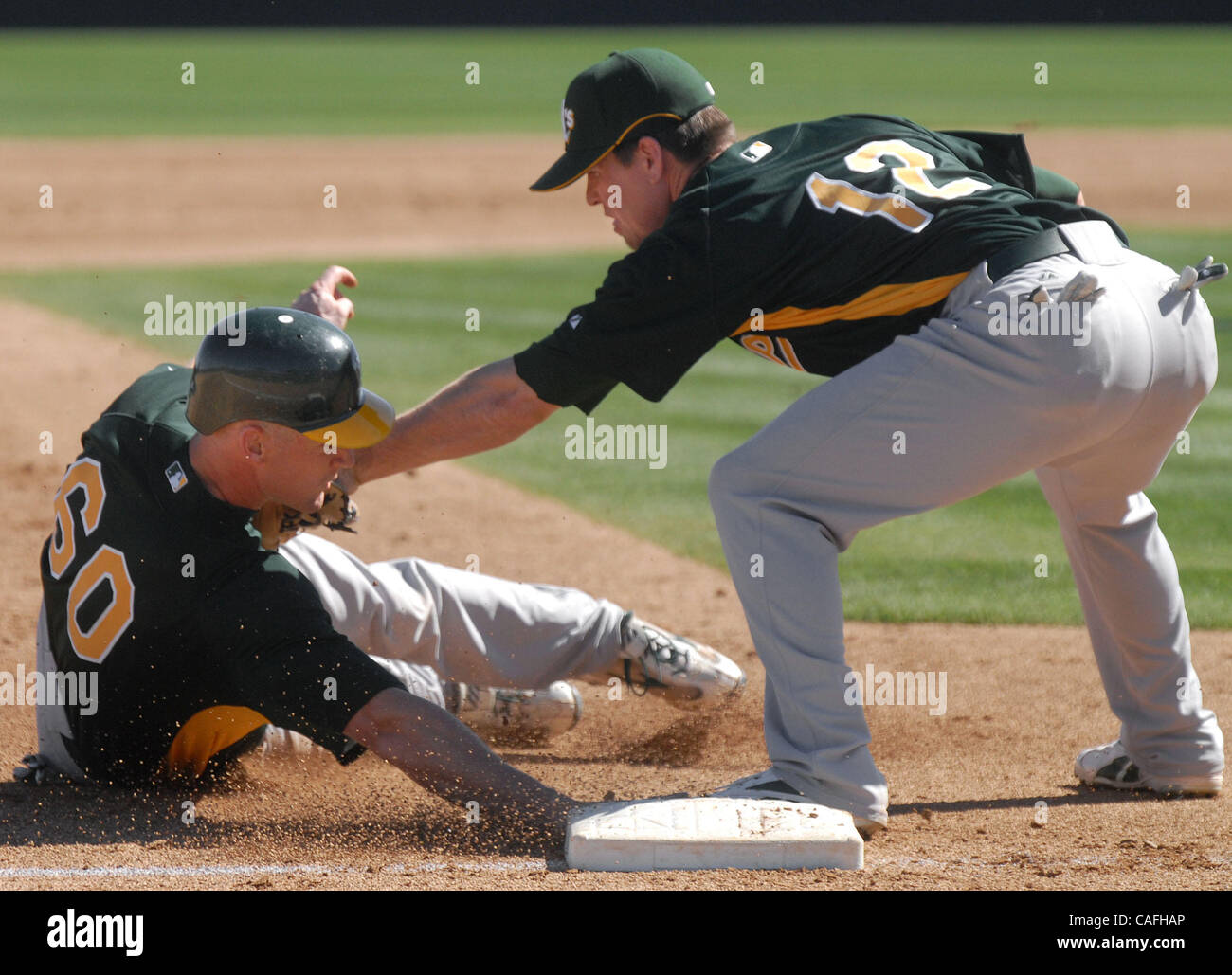 Infielder Donnie Murphy, right, tags out Justin Knoedler at third base ...