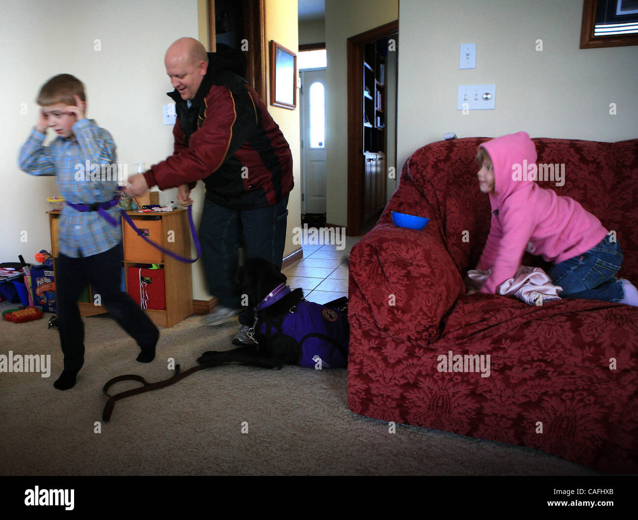 Rochester, Minn., 02/27/2008] Brad Trahan reaches for Reece, his ...