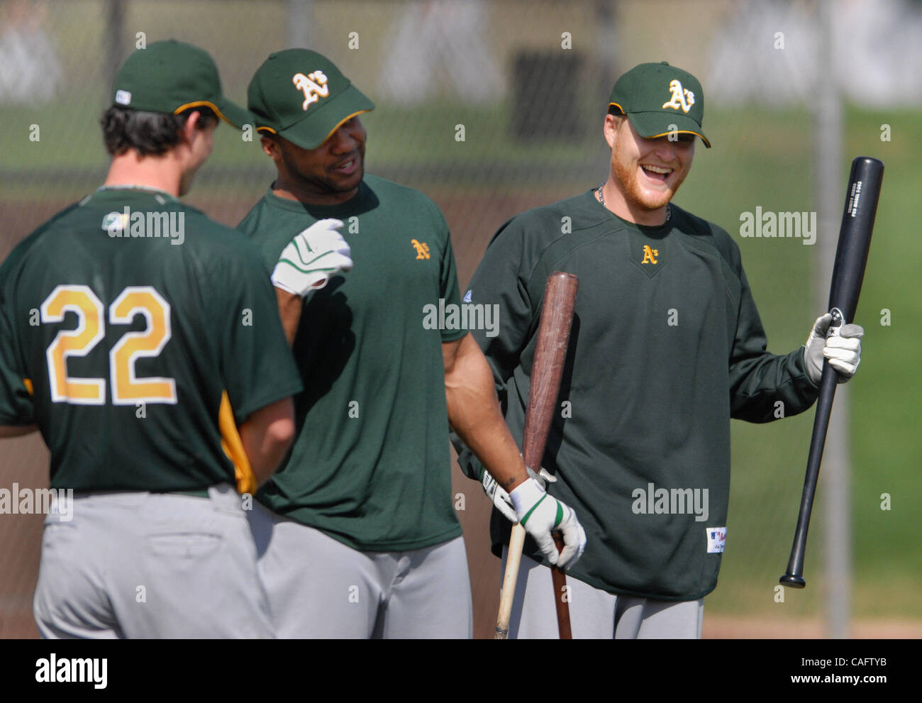 From left, Jack Hannahan, Emil Brown, and Dan Johnson joke around ...