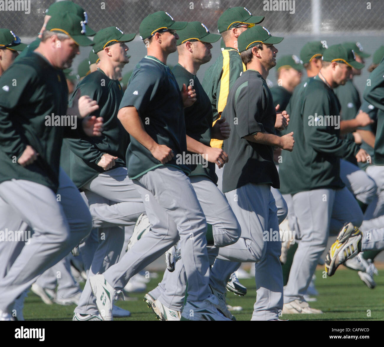 Oakland Athletics players, including Mark Ellis and Bobby Crosby, warm ...