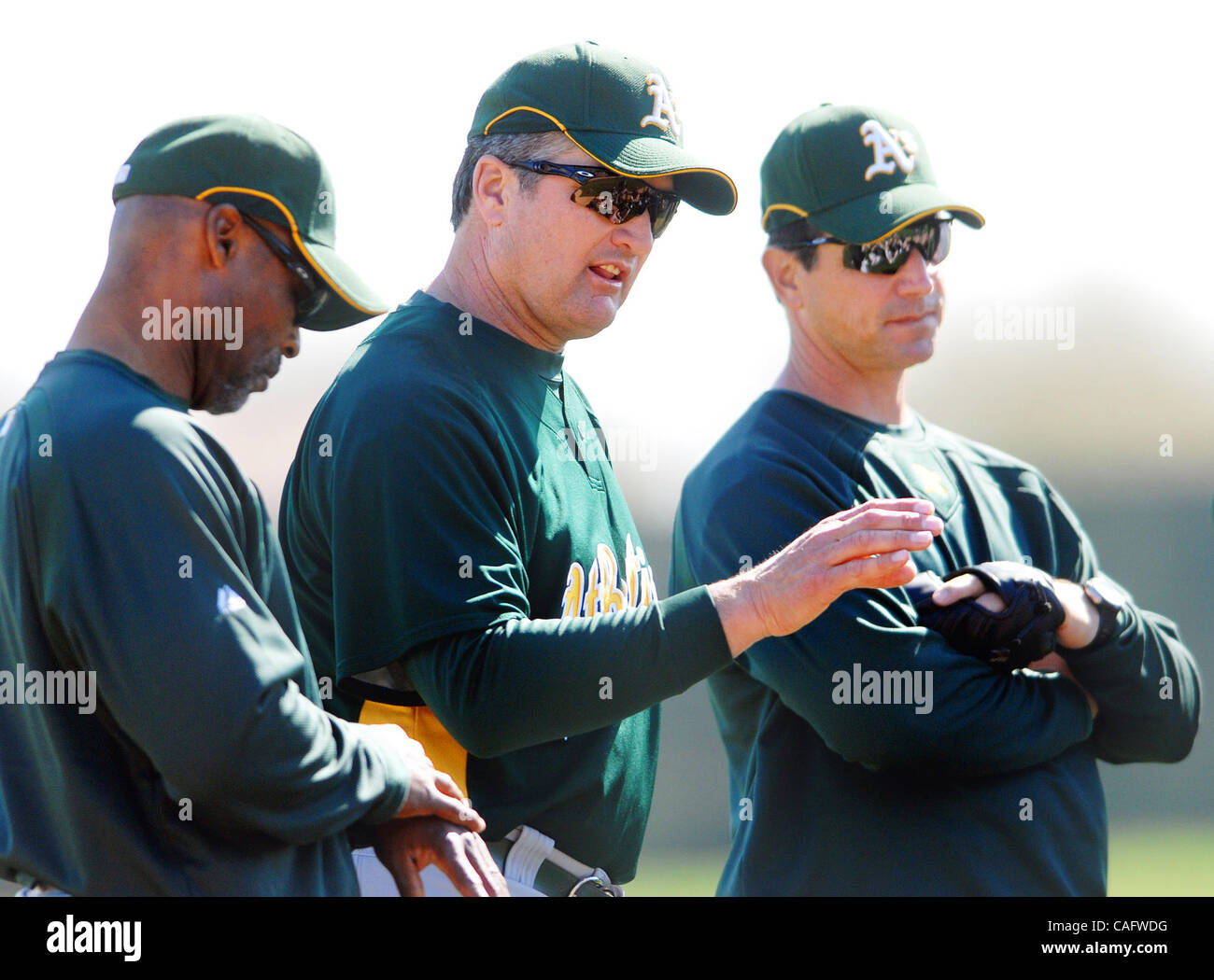 Oakland Athletics manager Bob Geren, second from left, talks to his ...
