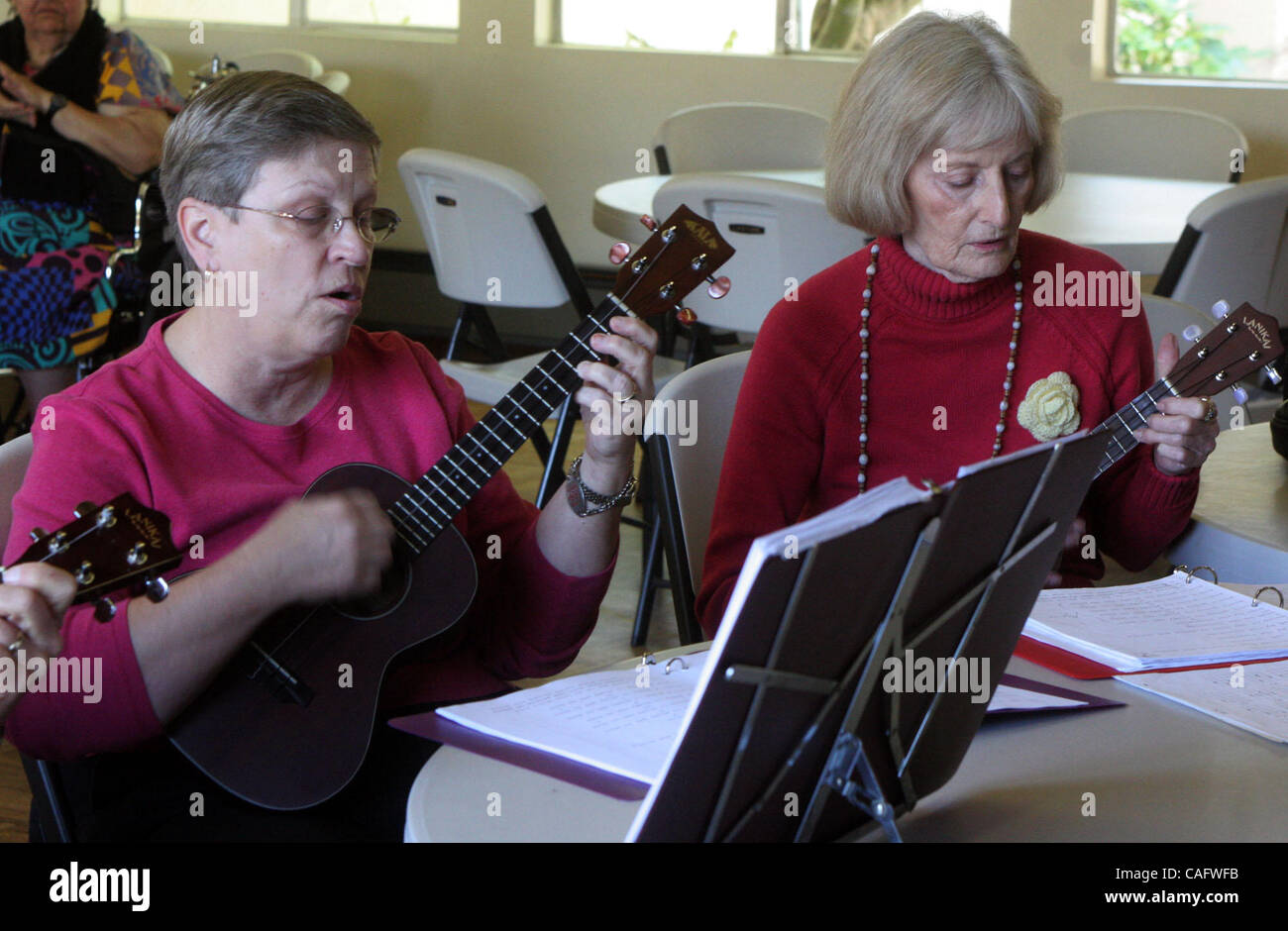 Colleen Vermillion (left) and Mary Ferlin play during ukulele class at ...