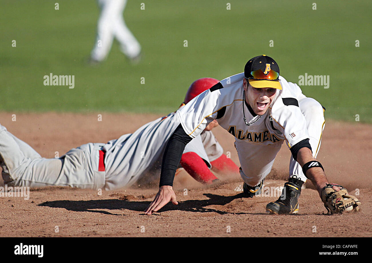 Alameda's Jordan Pries (right) tries to make a play while Berkeley's ...