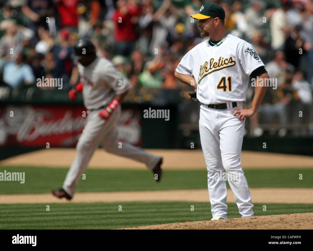 A's pitcher Alan Embree (right) looks on while Redsox DH David Ortiz ...