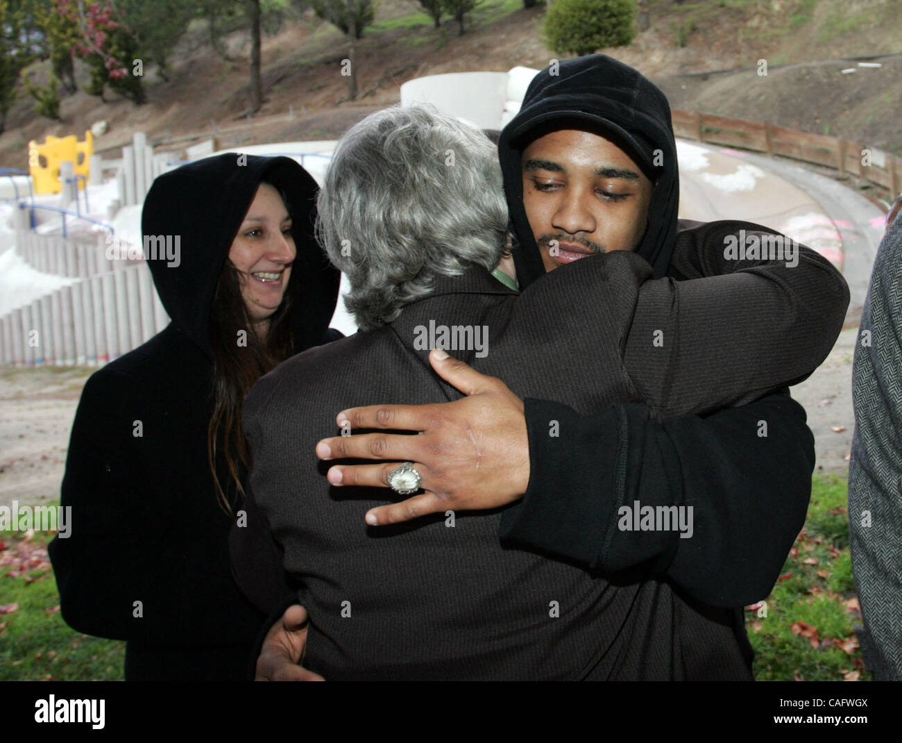 Brandon Manning, right, gets a hug from Richmond Mayor Gayle McLaughlin ...