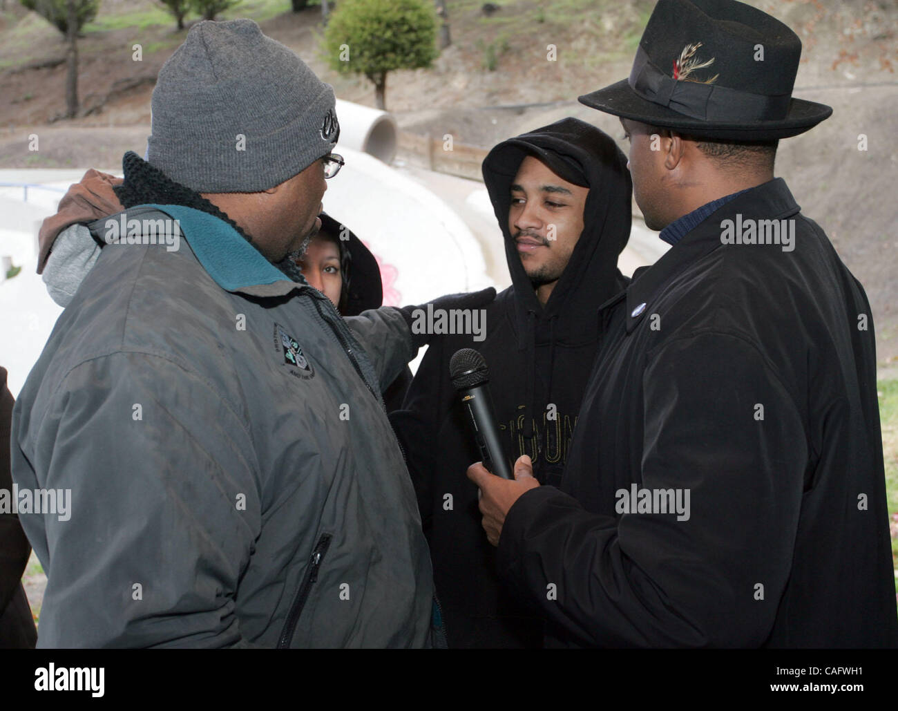 Brandon Manning, center, gets encouraging words from his father Curtis ...