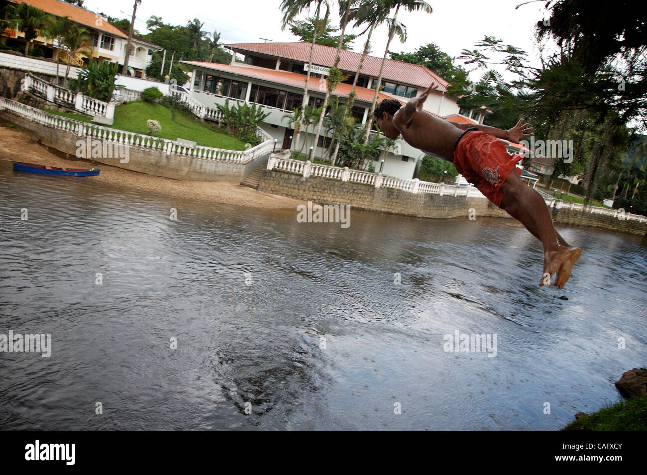 Kids dive and play in the river in Morretes, Brazil on February 21 ...