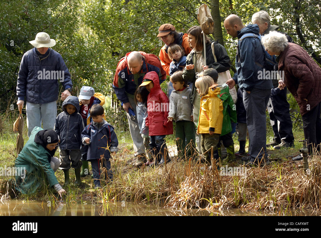 The group of parents and their children follow naturalist Bethany ...