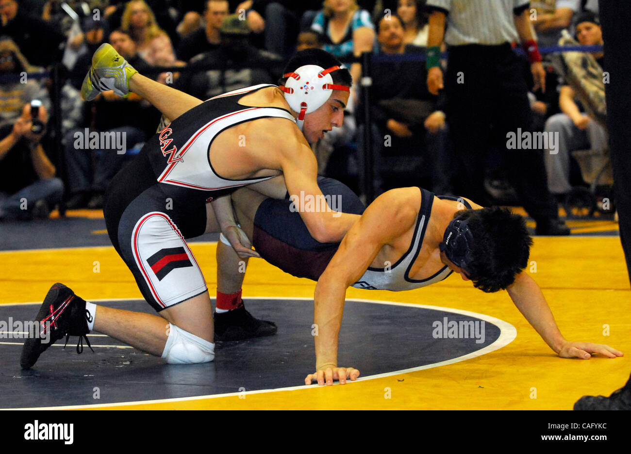 James Logan's Ruben Baca (top) battles Freedom's Mike Sherman during ...