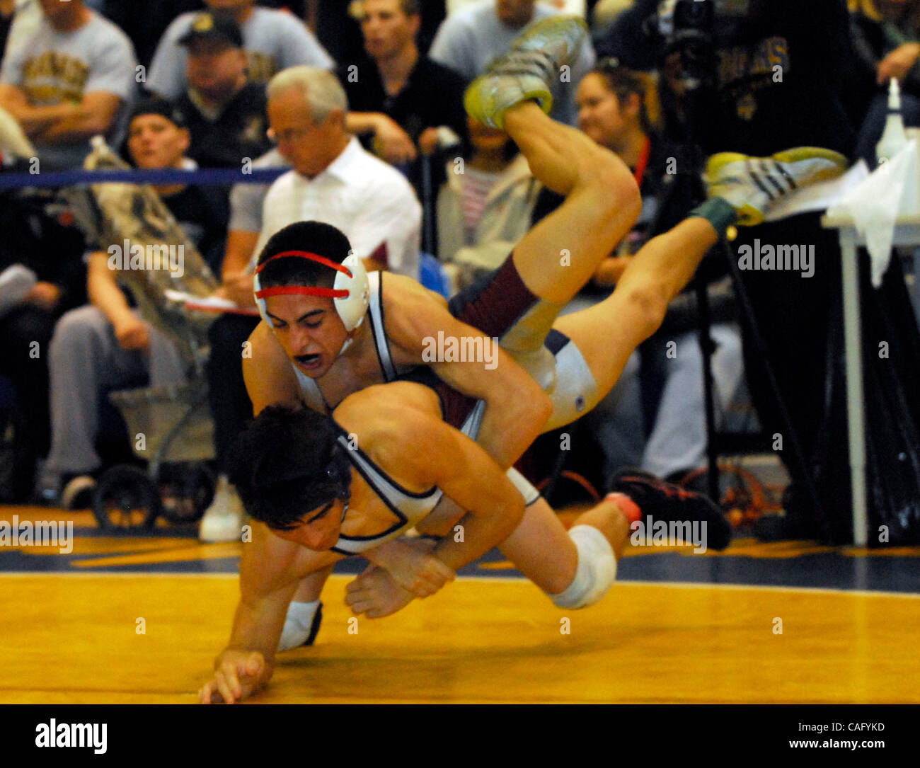 James Logan's Ruben Baca (top) takes down Freedom's Mike Sherman during ...