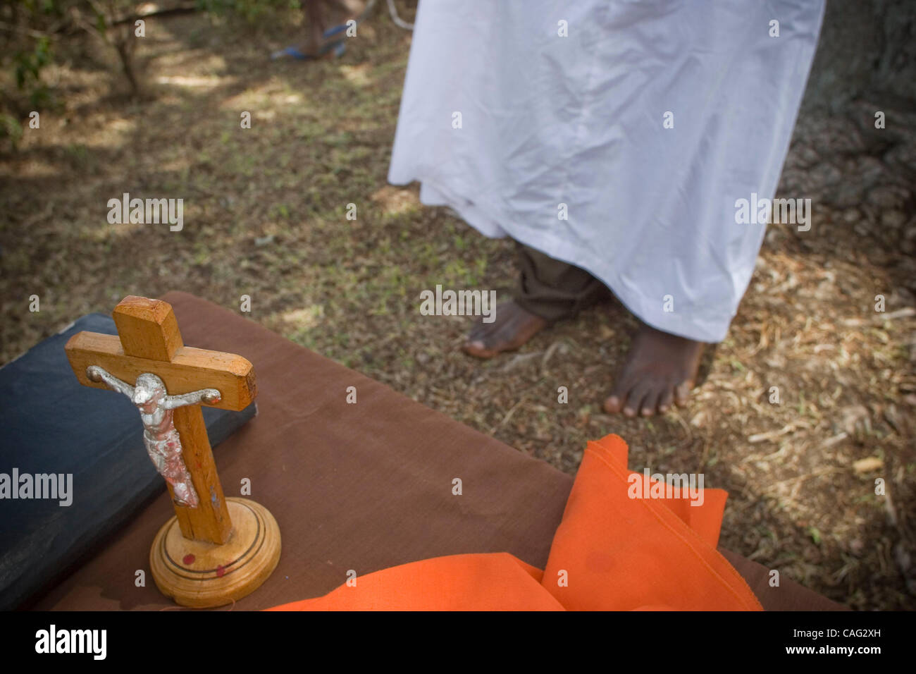 Pastor George Odhiambo, who is among the displaced, holds a Sunday ...