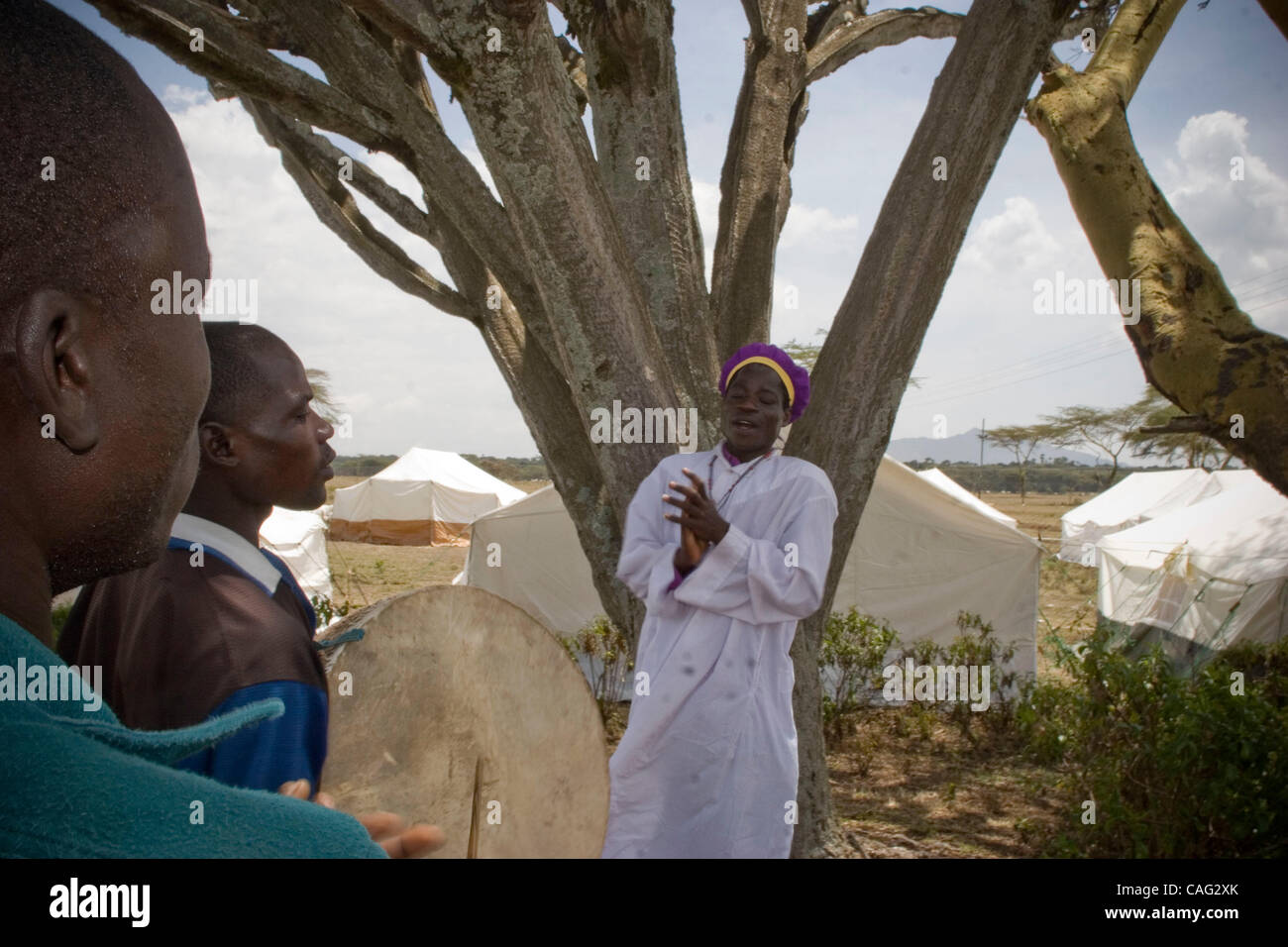 Pastor George Odhiambo, who is among the displaced, holds a Sunday ...