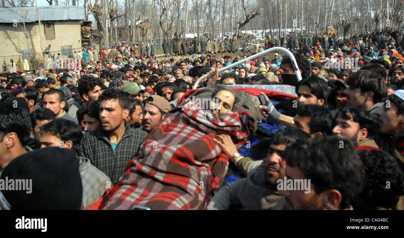 Kashmiri villagers carry the dead body of Mohammed Haneef, during ...