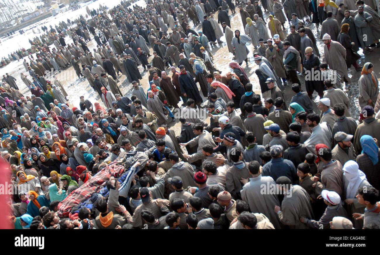 Kashmiri villagers carry the dead body of Mohammed Haneef, a commander ...