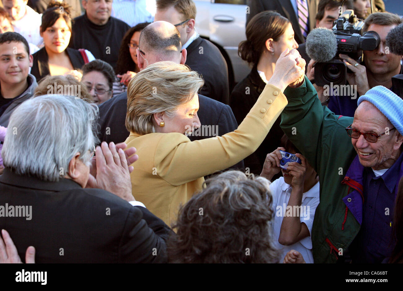 METRO Hillary Clinton gets a high handshake after walking the 1900 ...