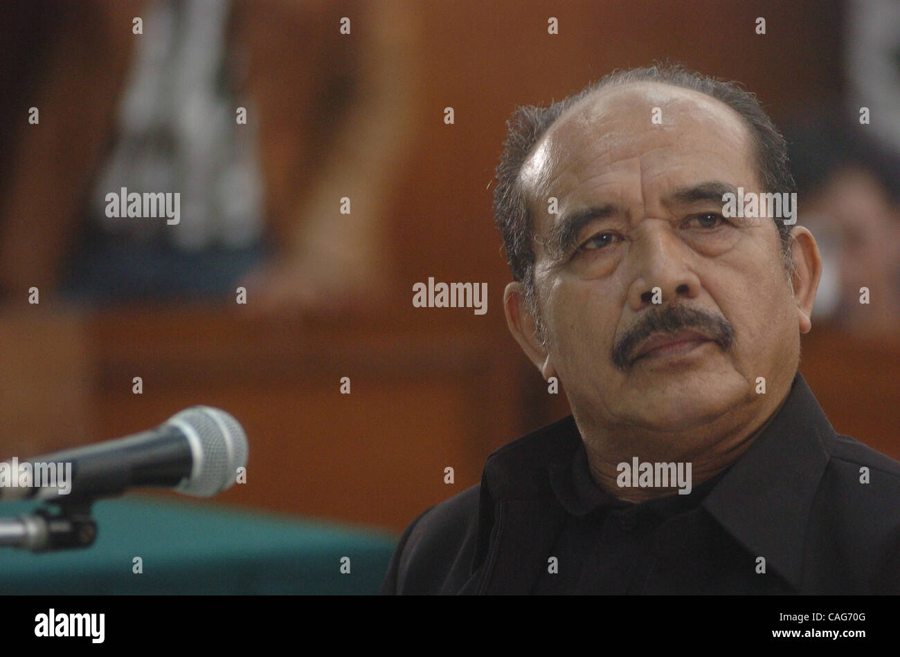 The leader of the Al Qiyadah Al Islamiyah sect Ahmad Mushaddeq listens ...