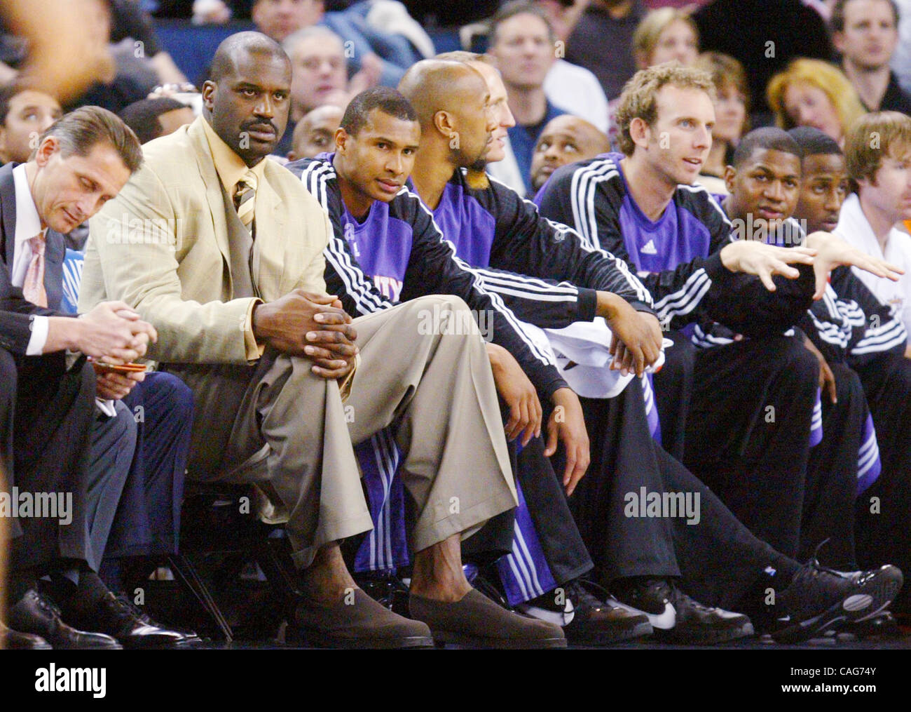 Phoenix Suns' Shaquille O'Neal, second from left, sits on the bench ...