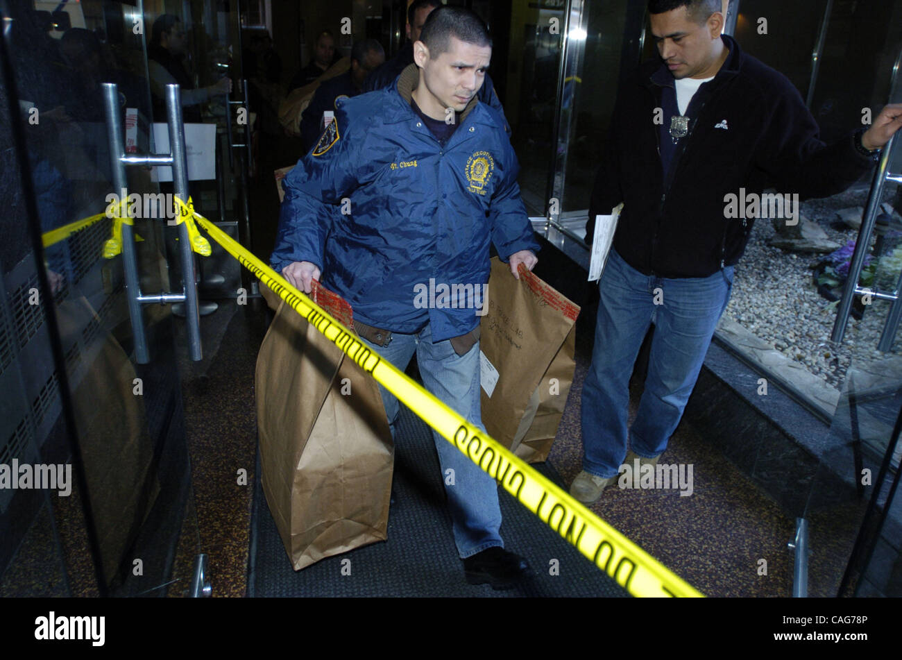 NYPD CSI officers remove evidence from the office building of KAthryn ...