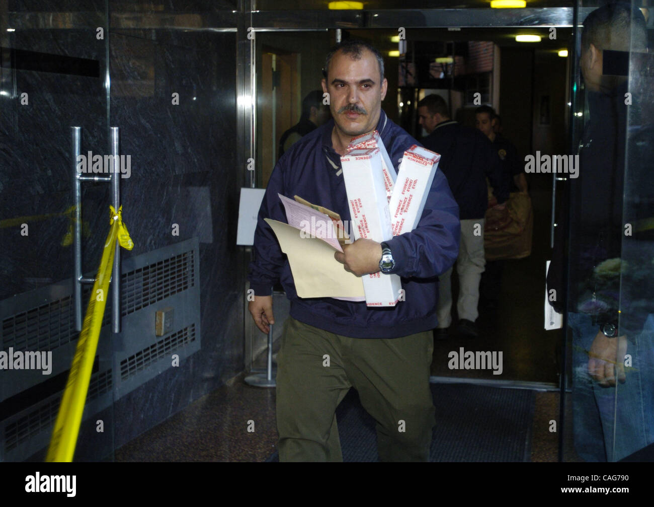 NYPD CSI officers remove evidence from the office building of KAthryn ...