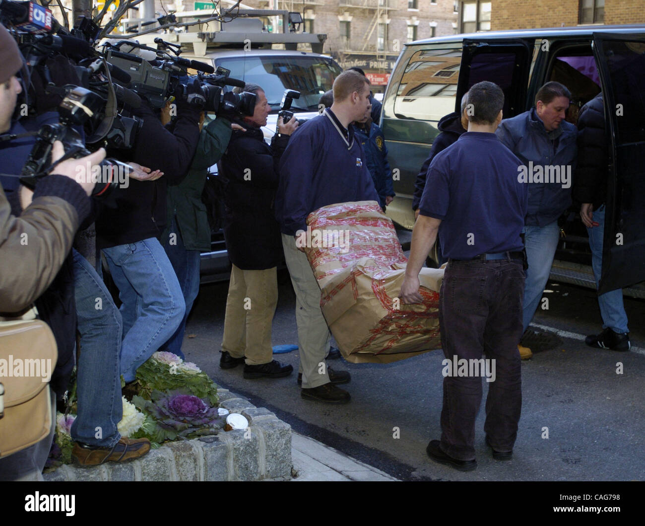 NYPD CSI officers remove evidence from the office building of KAthryn ...