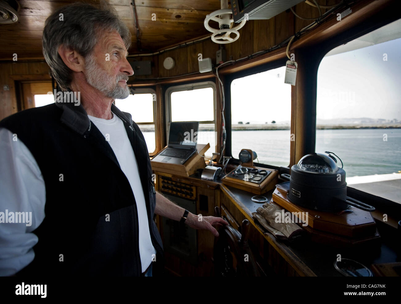 As captain of the Royal Melbourne, Dave Gore, 64, stands at the helm ...