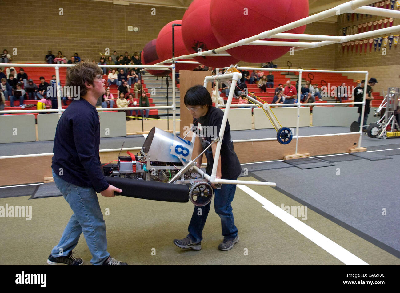 Davis high schoolers l-r Nathan Whitmore (cq) and Robert Chu (cq) carry ...
