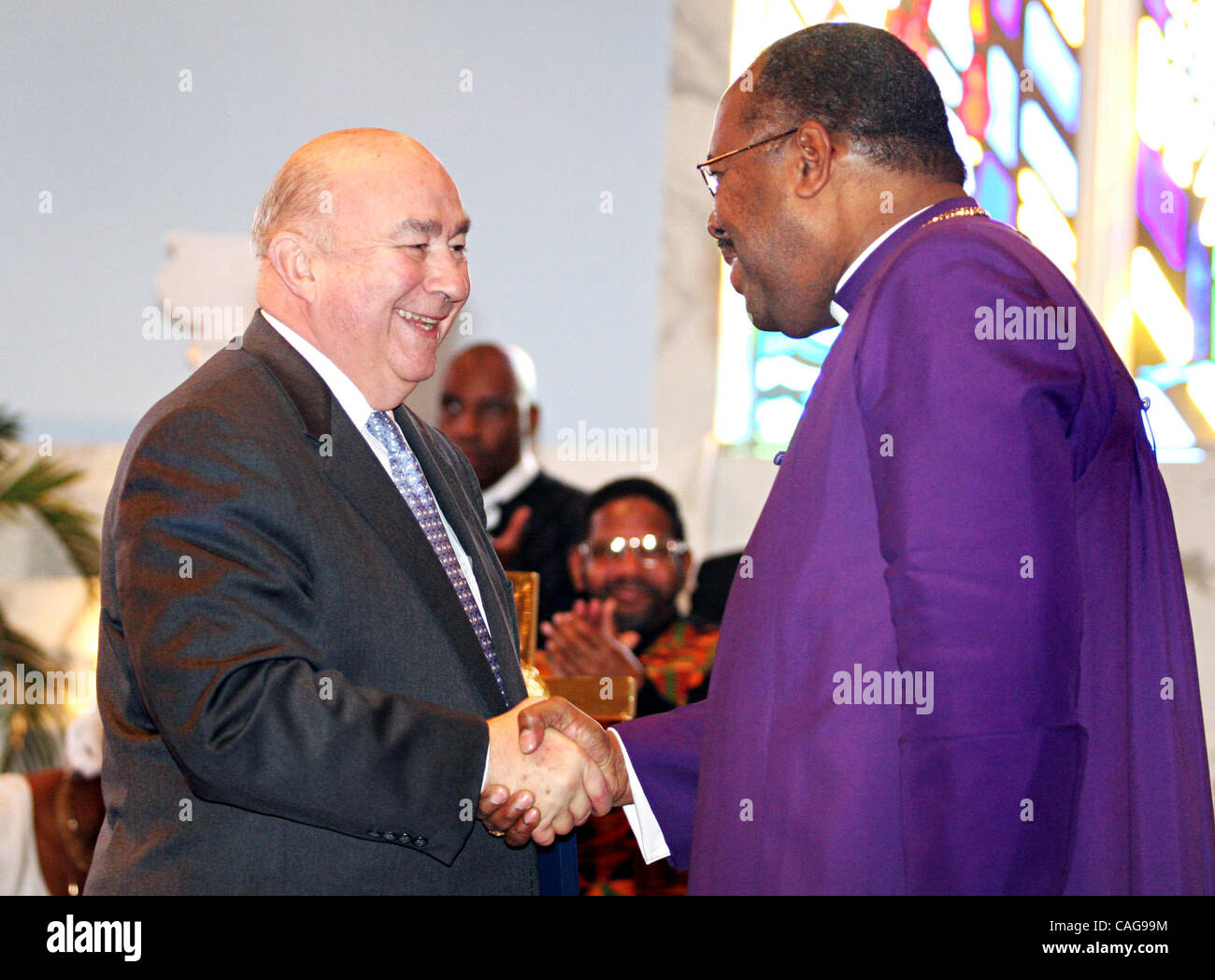 California State University Chancellor Charles Reed, left, shakes hand ...