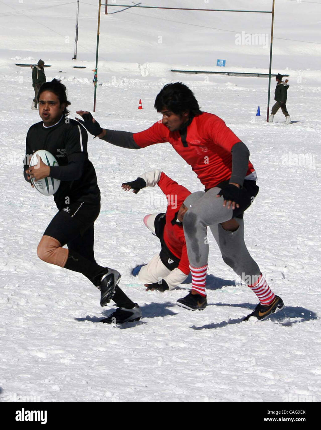 Players practise snow rugby after the opening ceremony of the National ...