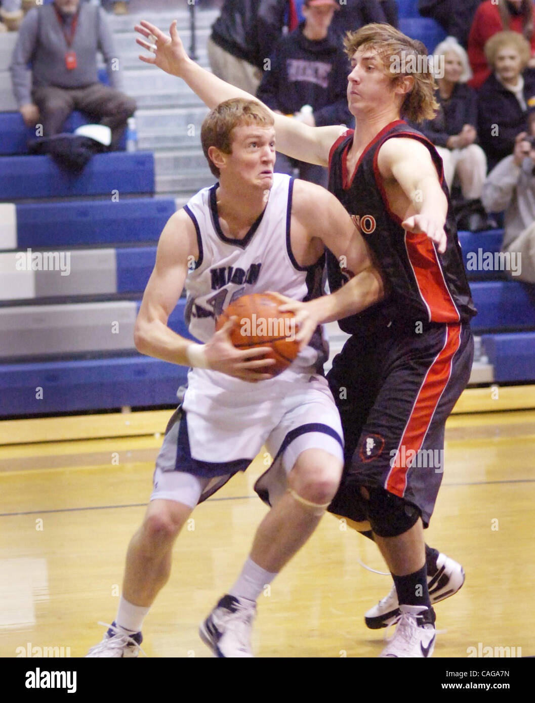 Ian Salter of Marin Catholic pushes past El Molino's Loren Brock during ...