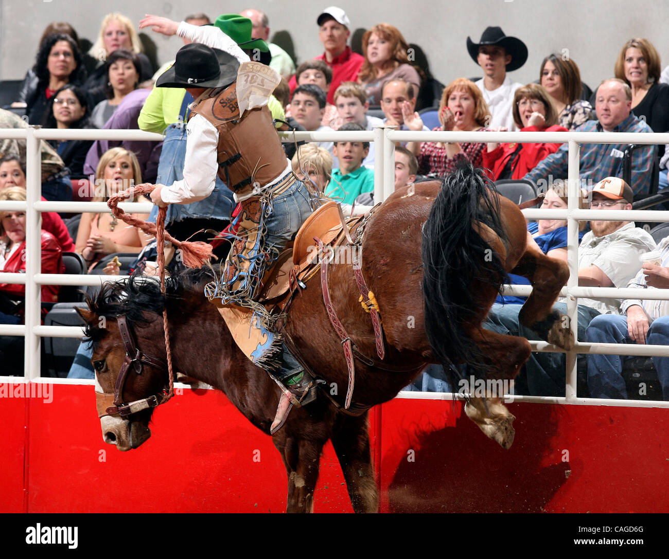 METRO The rodeo crowd watches a saddle bronc smash the gate Friday ...
