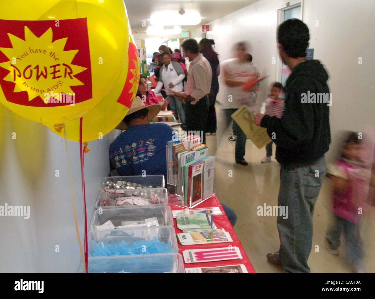Visitors peruse the literature at various tables during the National ...