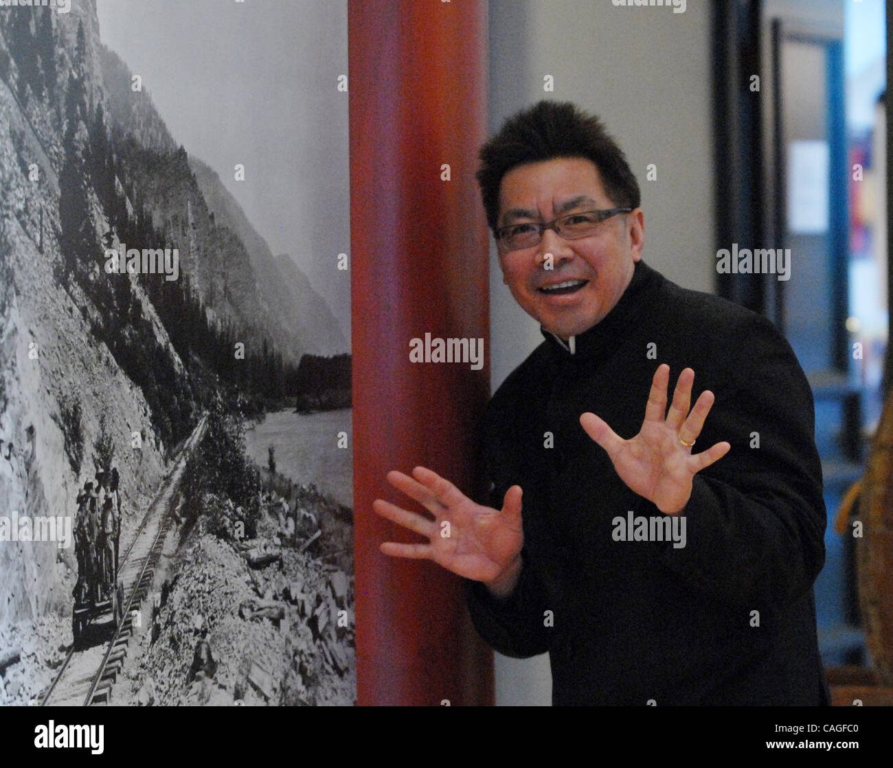 San Francisco based composer Jon Jang loosens up in front of a railroad ...