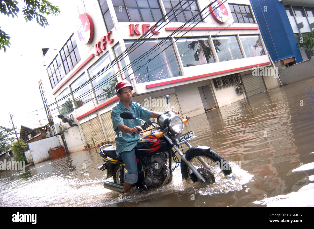 Feb 02, 2008 - Jakarta, Indonesia - An indonesia man ride his ...