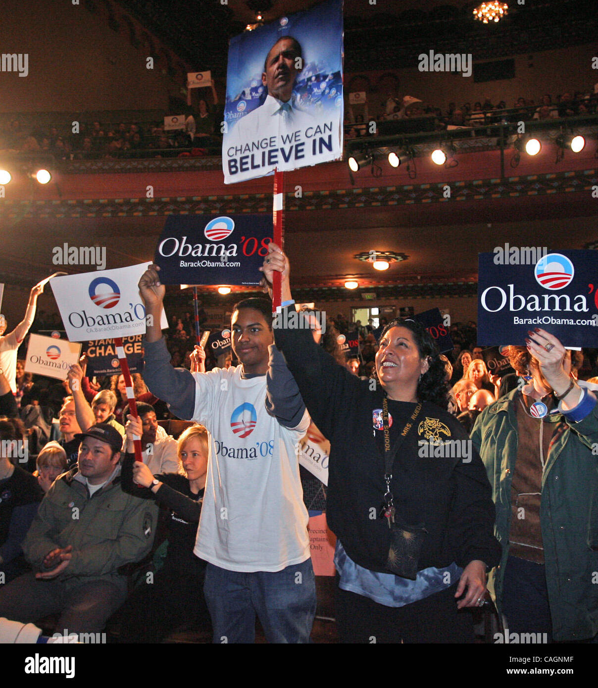 Antonio Ayala,17,left,and his mother Denise Rueda,center,hold signs ...