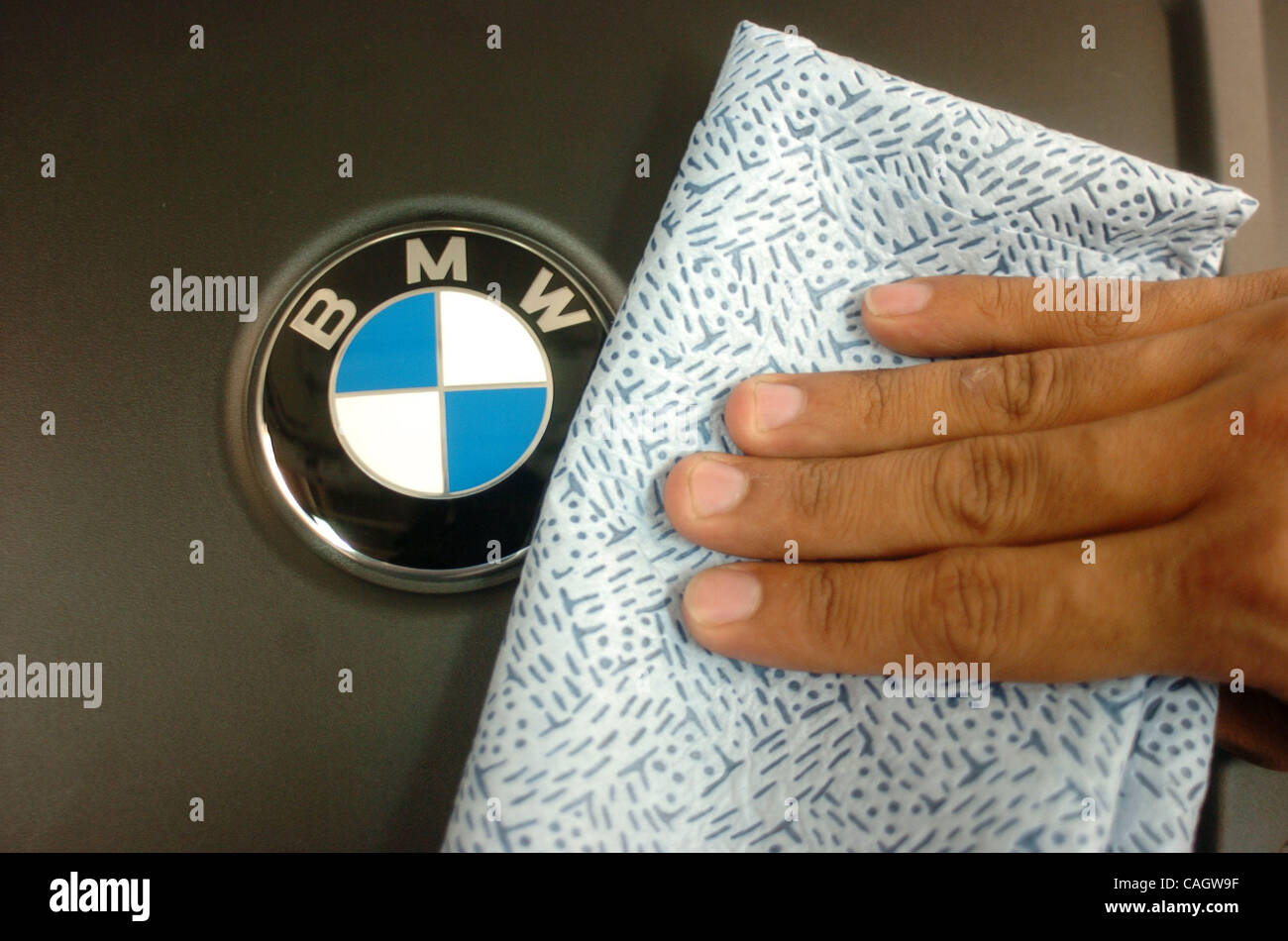 Worker clean BMW logo at BMW assembling factory in Jakarta, Indonesia ...