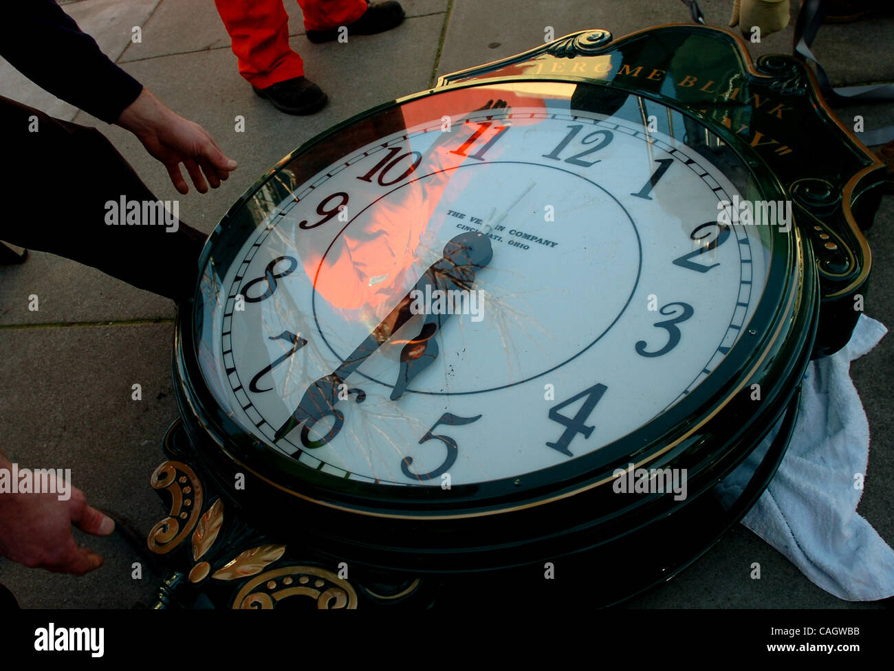 Maintenance Department workers prepare to return the Jerome Blank Clock ...