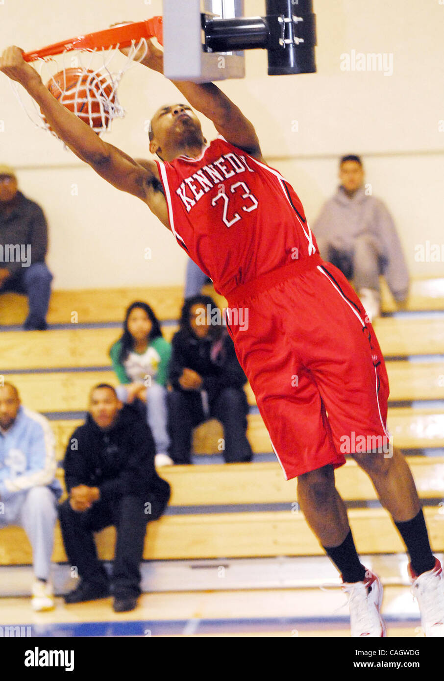Kennedy's Jonathan Williams finishes a fast break dunk during their ...