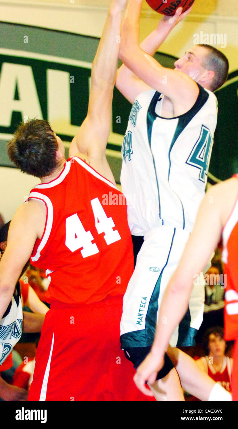 Manteca High basketball player Nick Scheible takes a shot over Ceres ...