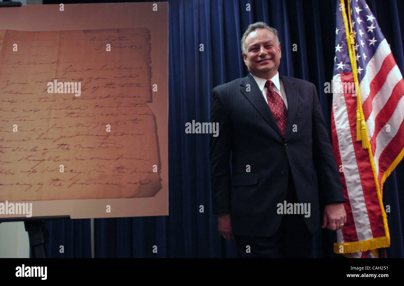 Joseph Romito stands beside a photograph of the Calhoun Letter as ...
