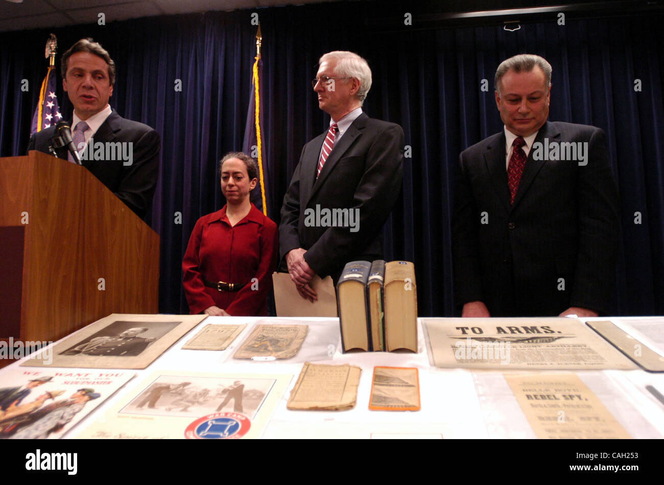 Attorney General Andrew Cuomo (L) speaks as Robin Baker (3rd from R ...