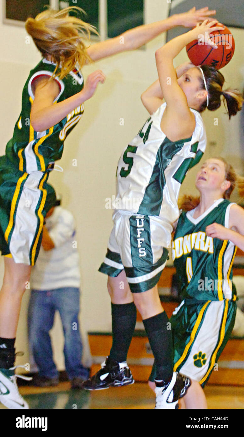 Manteca High basketball player Kristi Llamas tries for a shot over ...