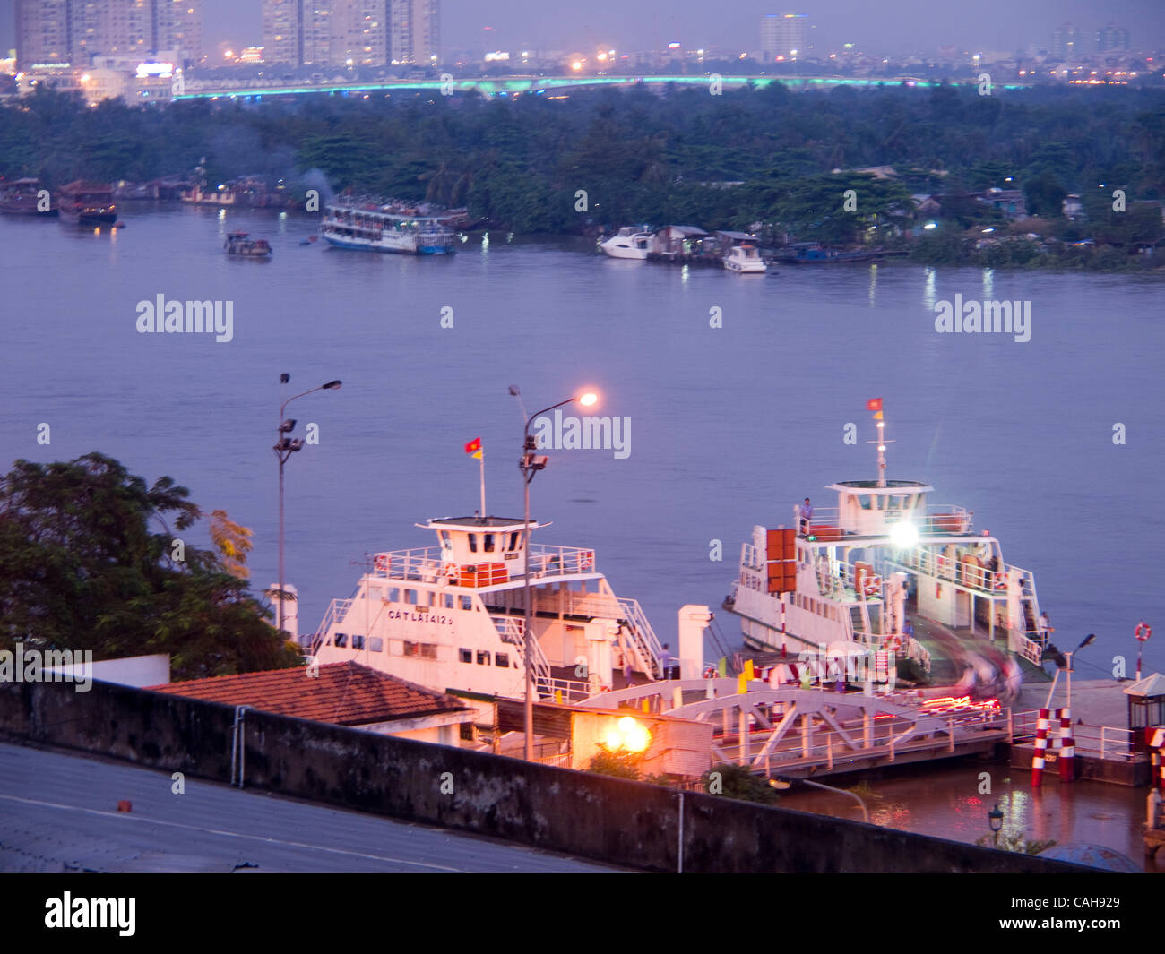 Ferry boats on river in Ho Chi Minh City, Vietnam Stock Photo - Alamy