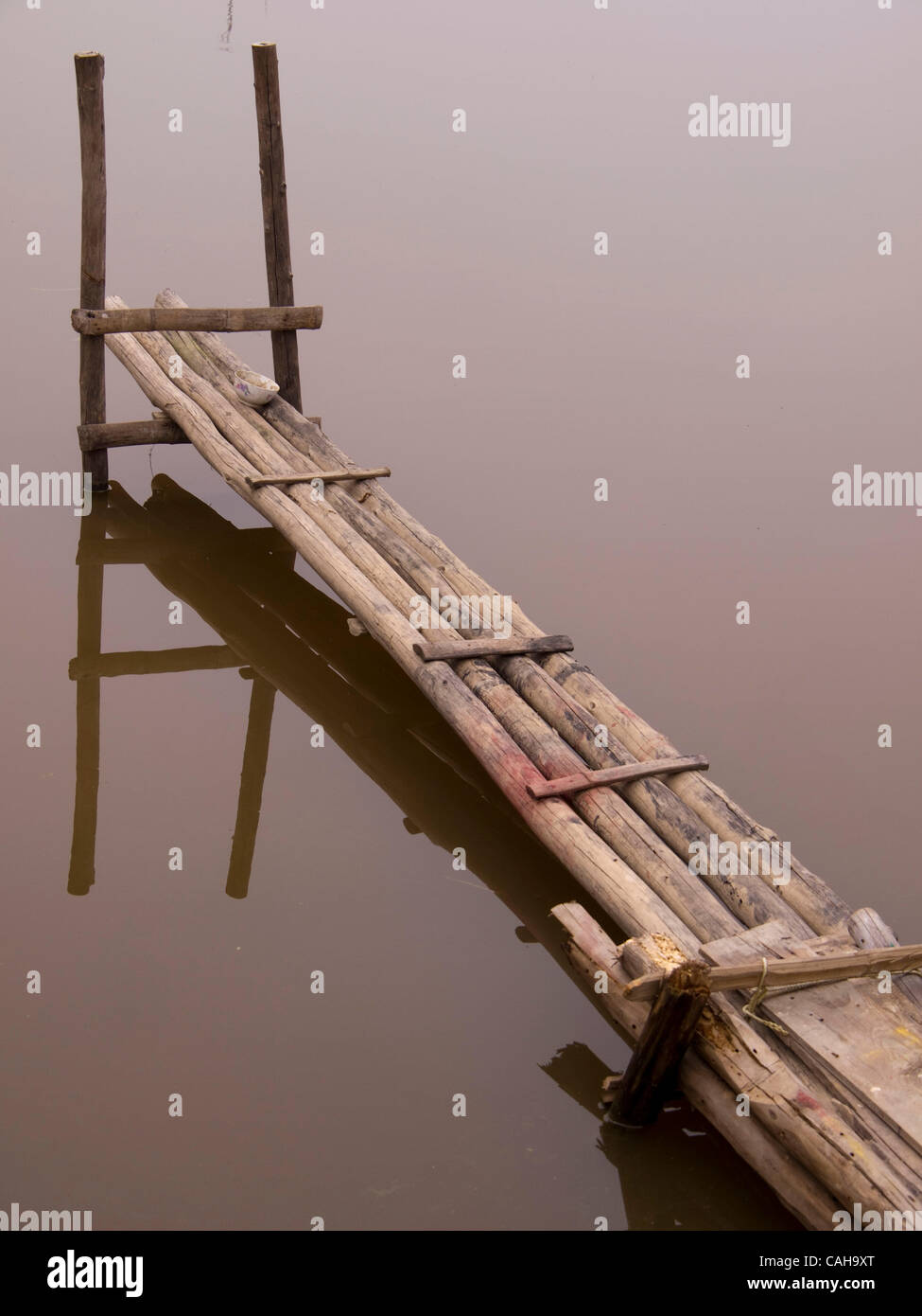 Simple bamboo pier on pond in Thuan Thanh, Vietnam Stock Photo - Alamy