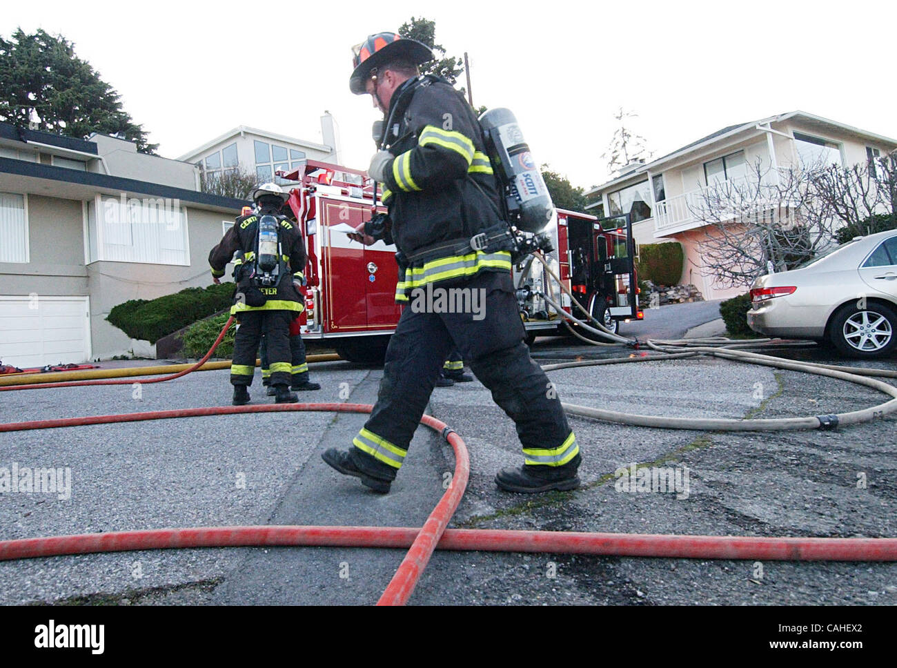 Firefighters mop-up a structure fire in a Millbrea, Calif ...