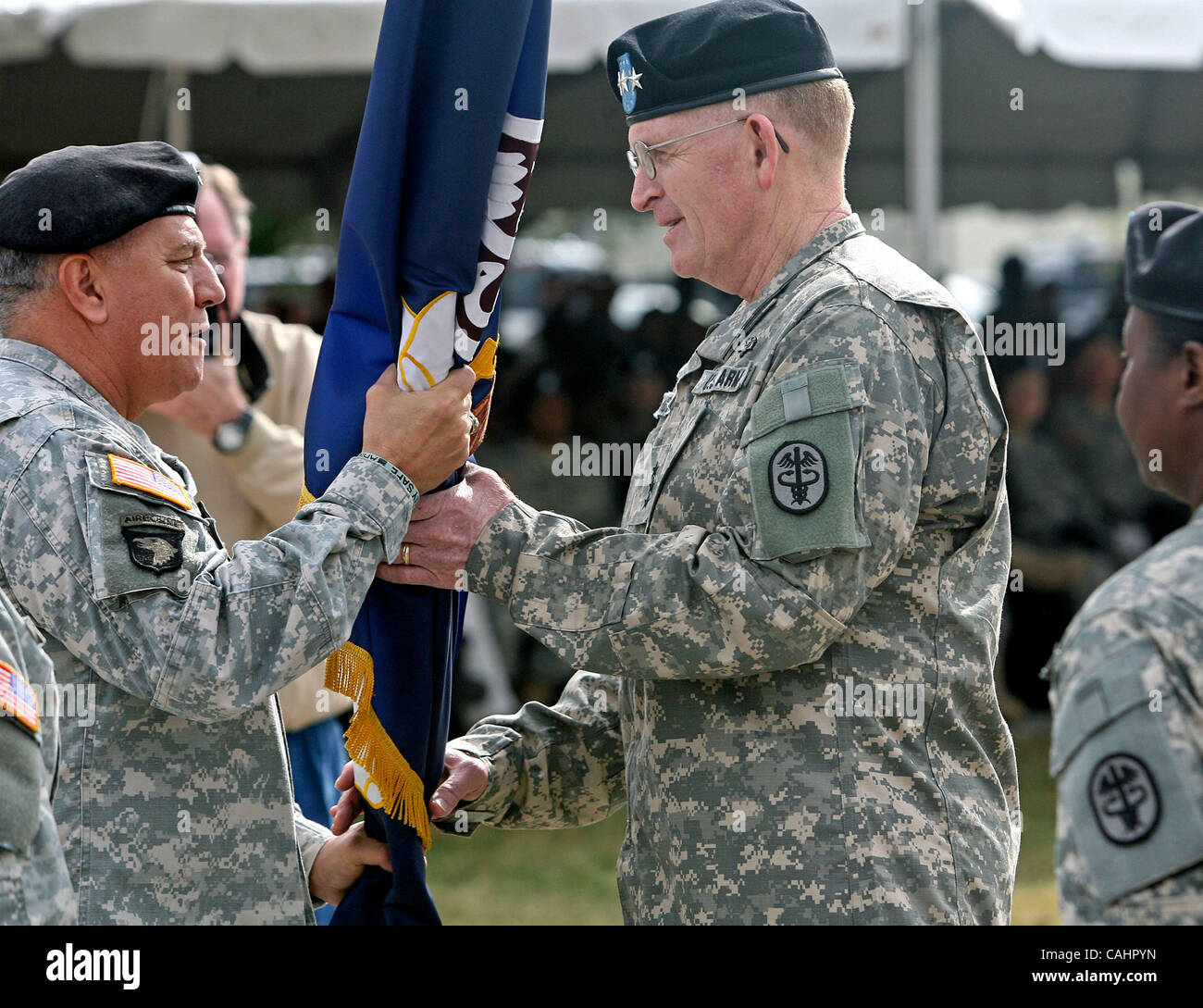 Metro Lt. Gen. Eric B. Schoomaker (center) accepts the colors from Army ...