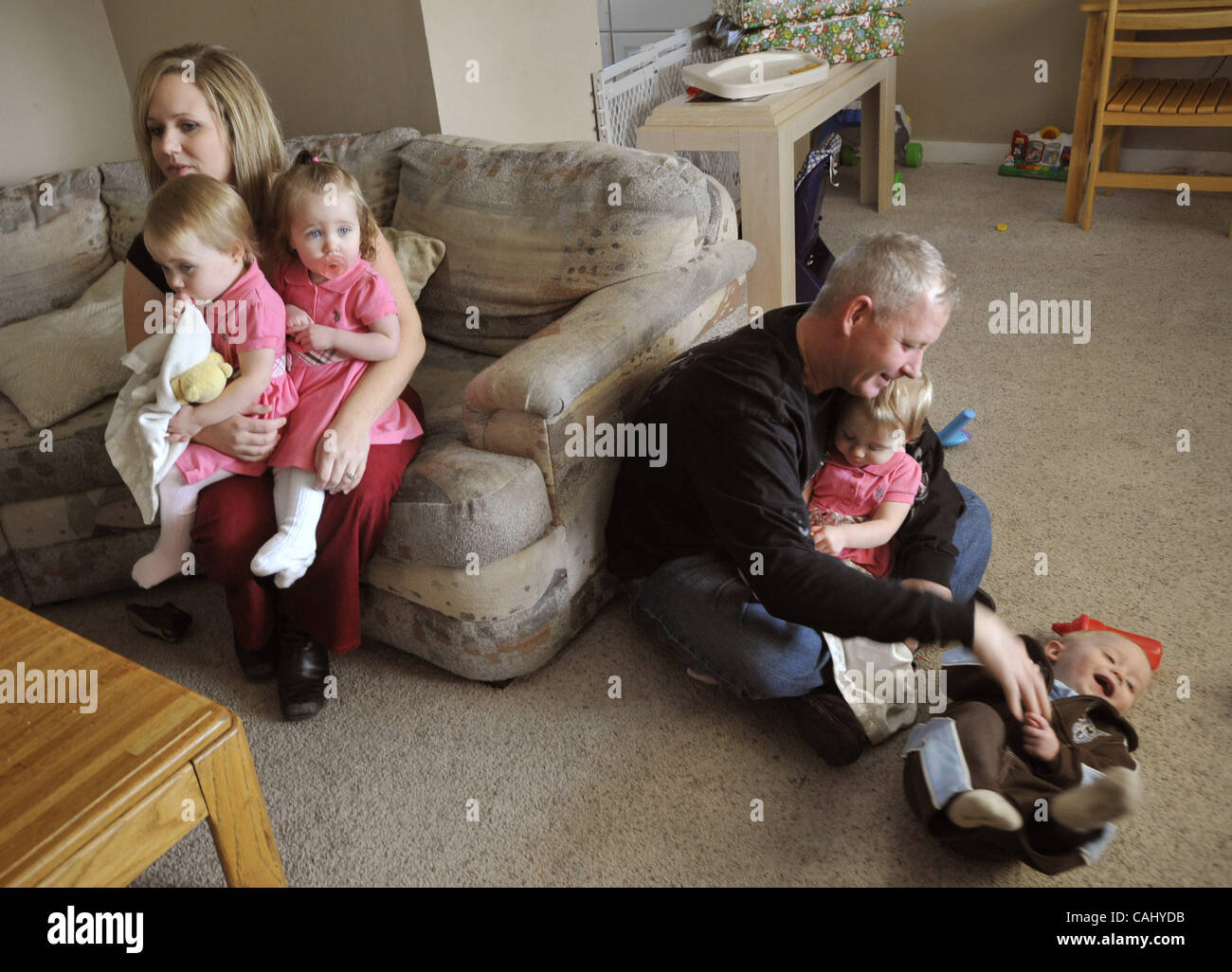 Everyone has their hands full as Natalie Allen holds her daughters ...