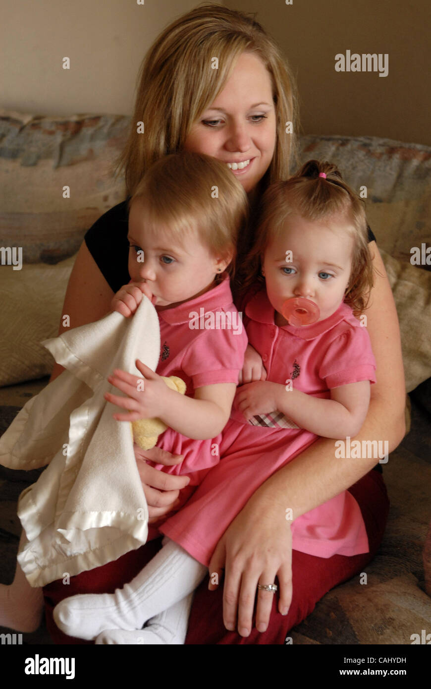 Natalie Allen has her hands full as she holds her daughters Katelynn ...
