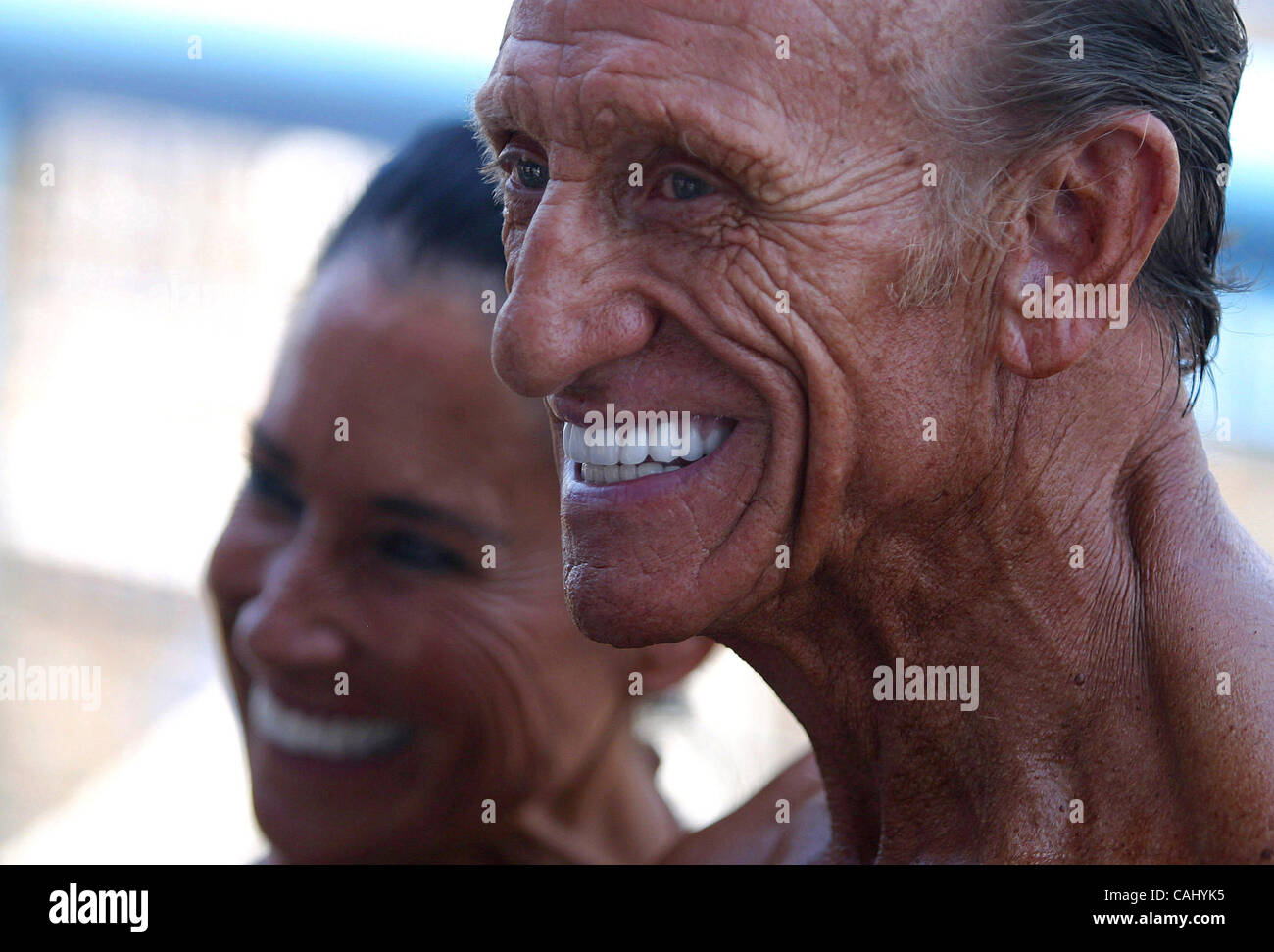 Bill Cunningham, 71, and Jane Hesselgesser, 61, relaxes backstage at a ...